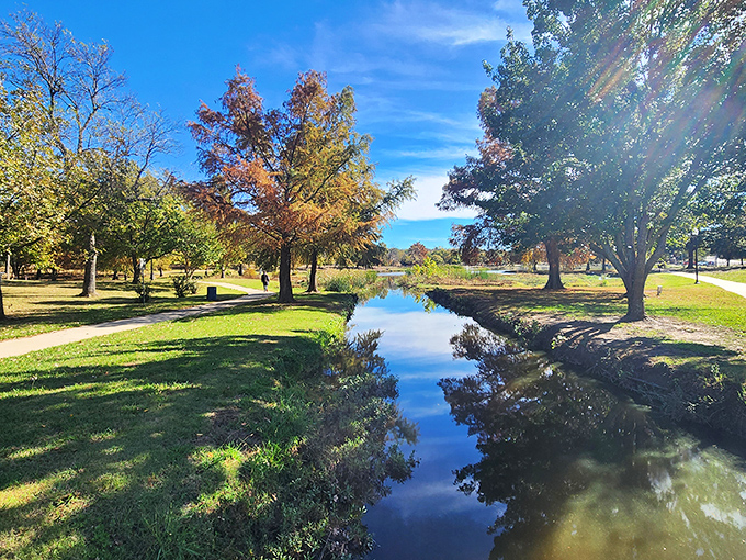 Ada's natural beauty includes peaceful streams reflecting autumn colors—nature's entertainment that costs exactly zero dollars to enjoy.