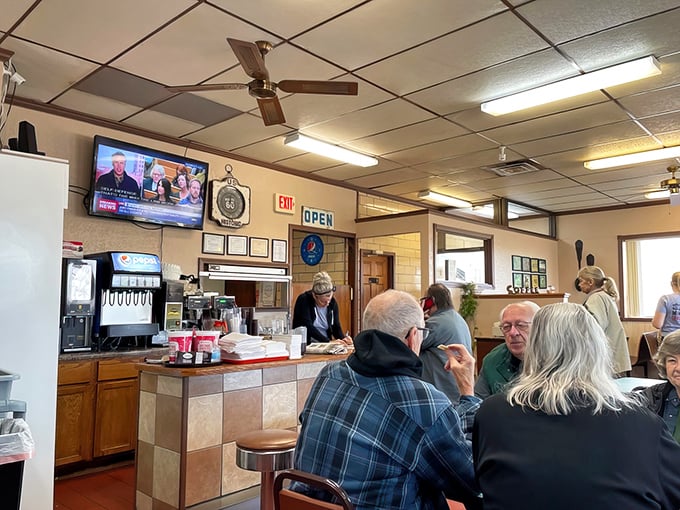 Where ceiling fans gently stir the aromas of breakfast while news plays softly overhead. Some have been sitting at these tables for decades.
