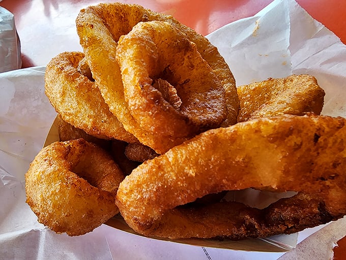 These onion rings aren't just side dishes—they're golden halos of crunch that deserve their own fan club.