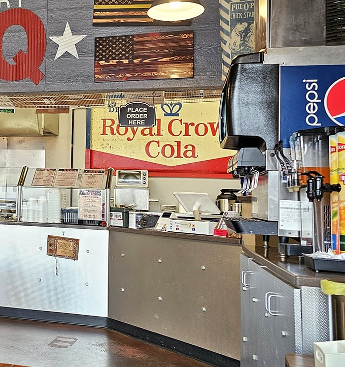 The order counter beneath that iconic BBQ sign—where dreams are ordered, fulfilled, and served with a side of hospitality.