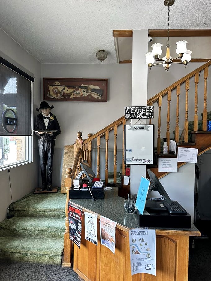 The host station and staircase—where first-timers become regulars and staff greet you like you're returning family after a long absence.