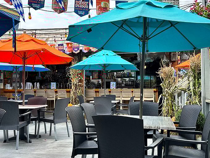 The outdoor patio offers a breezy escape with colorful umbrellas—perfect for summer evenings with a cold beer.