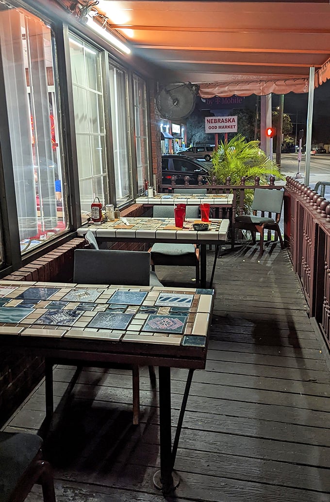 Outdoor seating with tile-top tables – where the Florida evening air mingles with the scent of coffee and possibility. Urban dining with neighborhood soul.