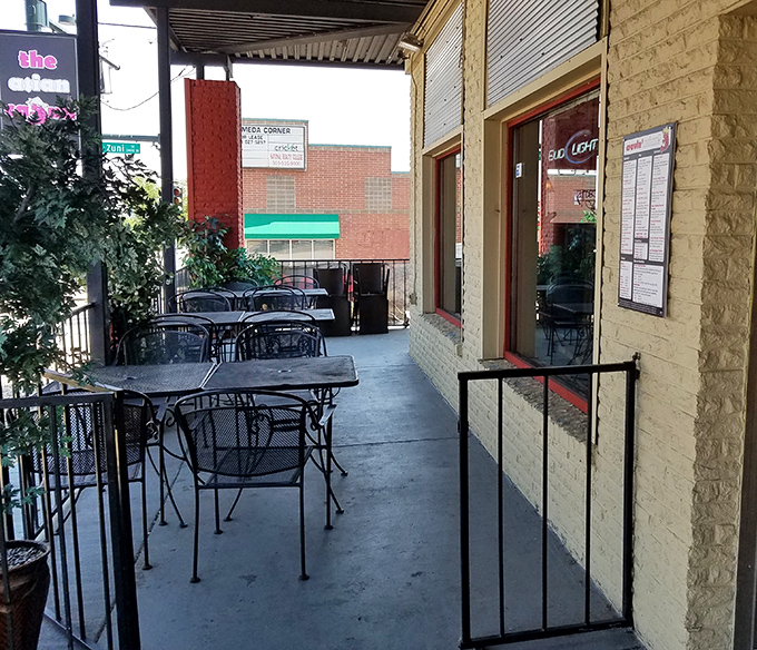The outdoor seating area—where fresh air enhances seafood flavors. Urban dining with a side of people-watching.