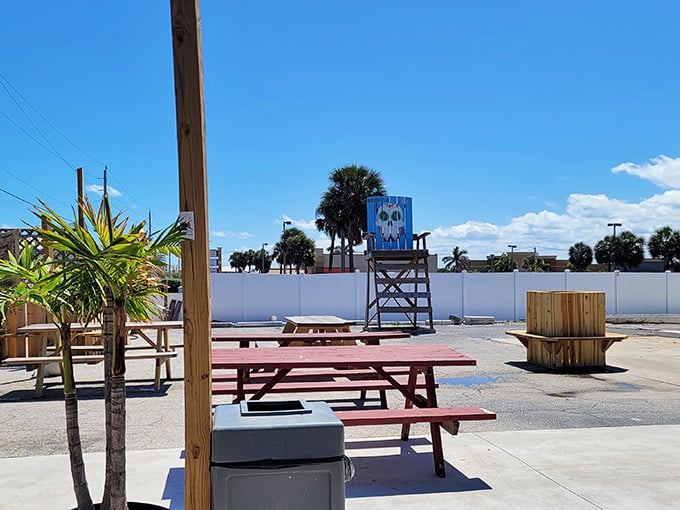 The dining room is the great outdoors. Red and blue picnic tables under palm trees—Florida's version of five-star ambiance.