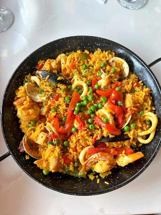 Paella that's worth the 45-minute wait—a vibrant Spanish fiesta where each grain of saffron rice has invited sea creatures to the party.