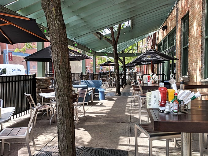 The patio where summer memories are made. Dappled sunlight filters through trees, creating the perfect outdoor setting for pints and conversation.