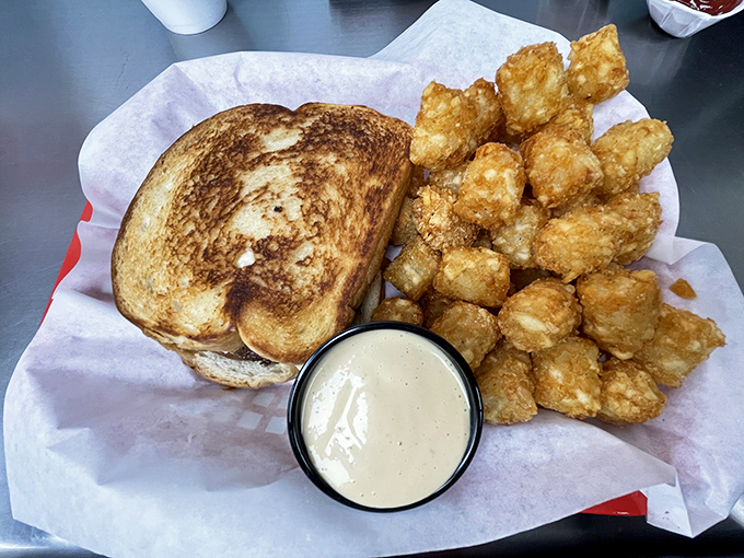 This patty melt with golden tots and house-made ranch isn't just lunch – it's therapy on a plate. Comfort food that understands you better than your therapist.