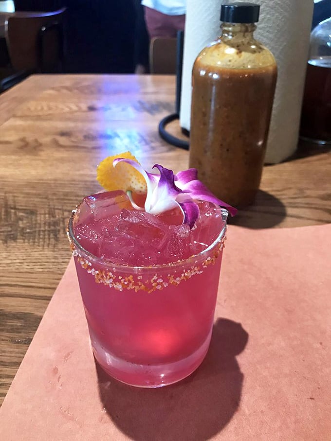 Even the cocktails get the Texas treatment. This vibrant concoction proves ZZQ's attention to detail extends well beyond the smoker.