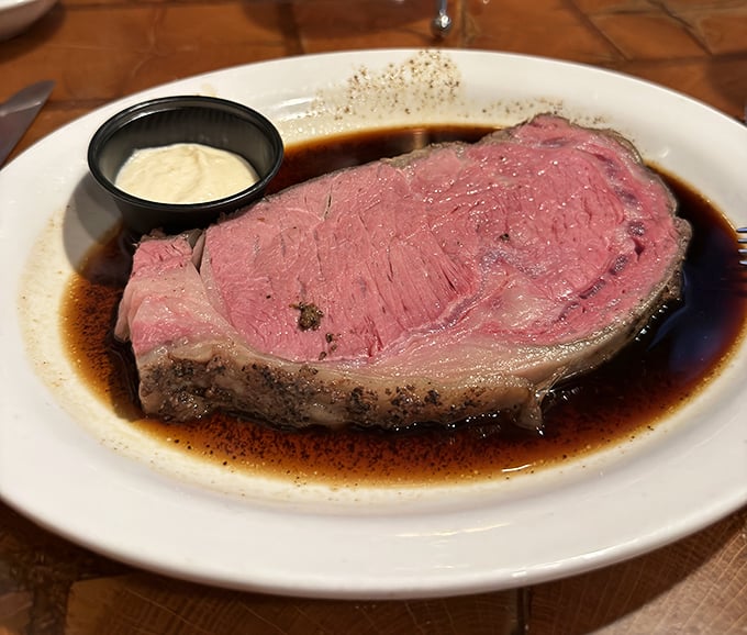 Prime rib that's practically blushing with perfection. That horseradish cream isn't just a condiment—it's the perfect foil to rich, mineral-forward beef.