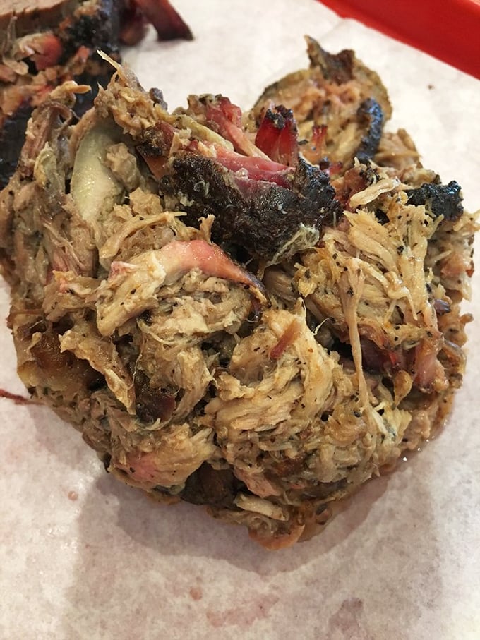Pulled pork with that perfect mix of bark and tender meat—the BBQ equivalent of hitting the jackpot.