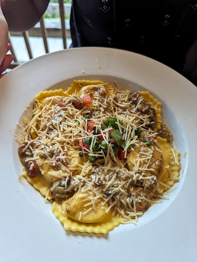 Ravioli swimming in a creamy sauce topped with fresh parmesan proves Schooners isn't just about seafood—they've got range in their culinary arsenal.
