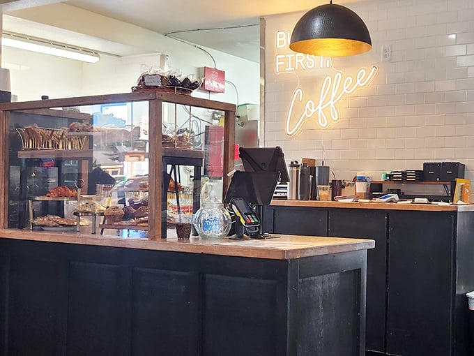 "But first, coffee" isn't just a sign—it's a life philosophy. The pastry case stands guard, tempting even the most determined "just-coffee" customers.