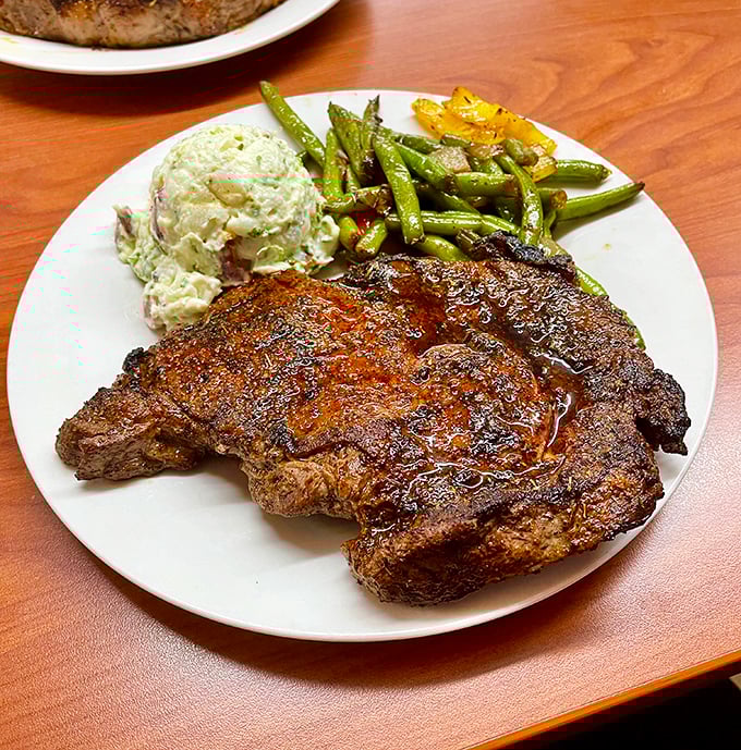 This ribeye isn't just cooked—it's respected. The perfect sear, the thoughtful sides—this plate understands the difference between eating and dining.