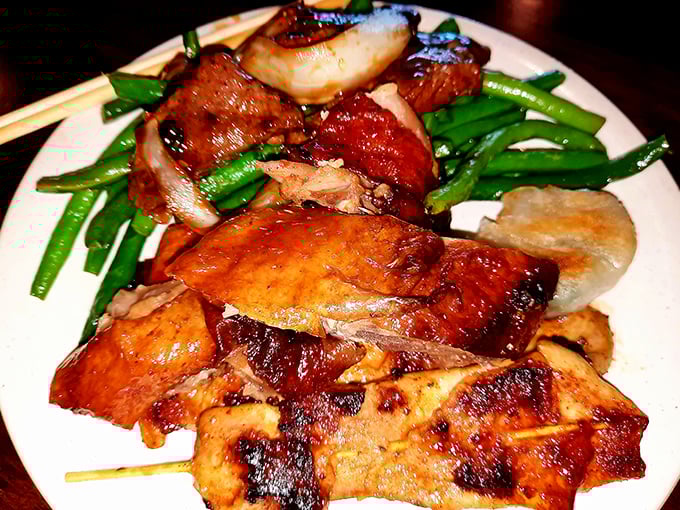 Roasted duck glistens with lacquered perfection alongside vibrant green beans—proof that buffets can indeed rise above their reputation.