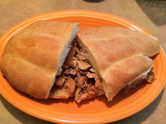 This torta isn't just a sandwich—it's an architectural marvel of bread and filling that requires both hands and your complete attention.