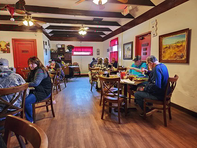Wooden tables that have hosted countless conversations and clean plates. The exposed beams above have witnessed millions of "mmms" over the years.