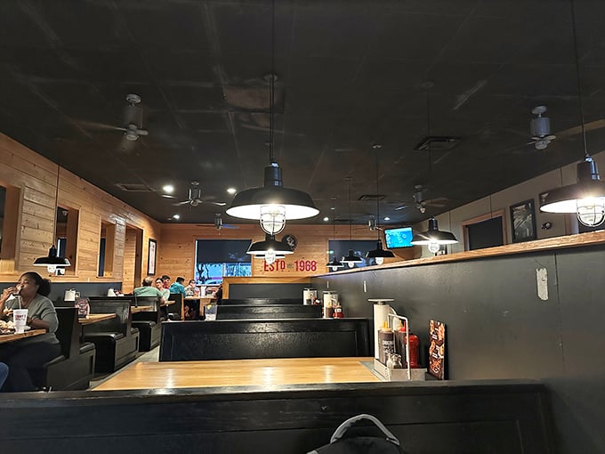 Dark ceilings, wooden walls, and comfortable booths create that perfect "stay awhile" vibe that turns first-time visitors into regular customers.
