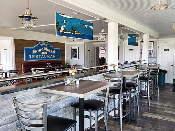 Nautical-inspired dining spaces that feel like the captain's quarters of a very tasteful ship. Those pendant lights cast the perfect glow for seafood appreciation. 
