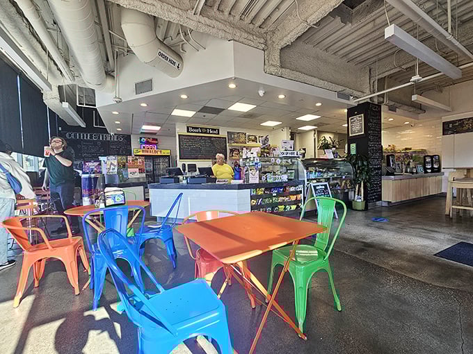 Colorful chairs invite you to stay awhile—a rainbow of seating options that say "your sandwich deserves proper attention."
