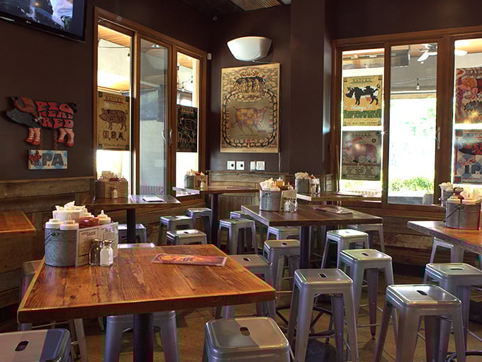 Rustic wooden tables paired with industrial stools – where barbecue philosophies are debated and sauce-stained napkins tell tales of delicious defeat.