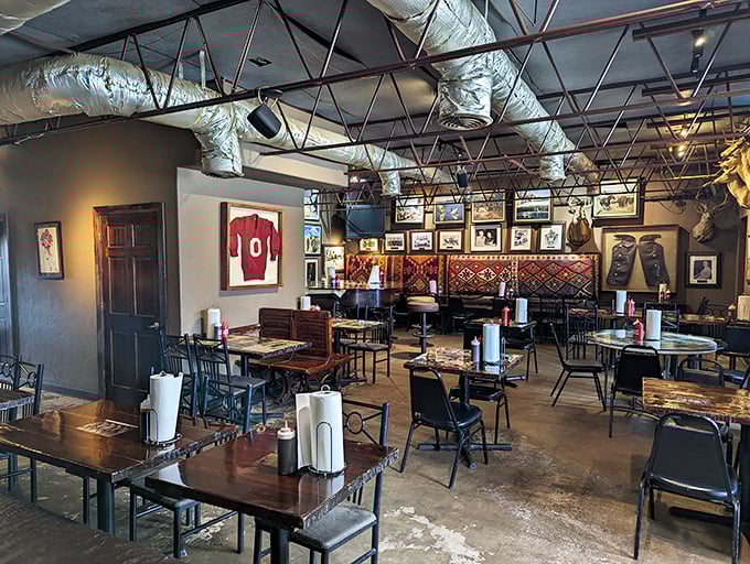 Simple tables and chairs in a room adorned with local sports memorabilia – because great barbecue doesn't need fancy surroundings to shine.