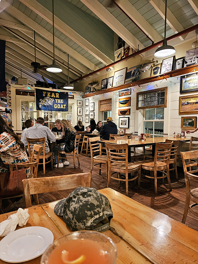 Nautical charm meets dining comfort under exposed beams. That "Fear The Goat" banner suggests there's a story worth hearing.