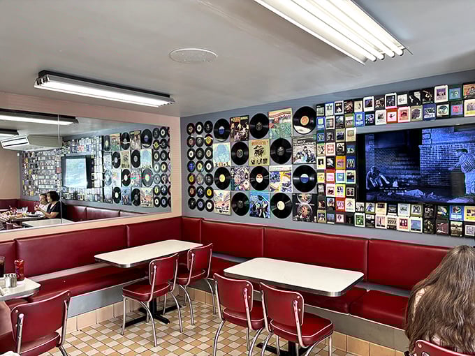 Where vinyl meets vintage—these booths aren't just seating, they're front-row tickets to a rock-and-roll museum that celebrates music while you celebrate breakfast.