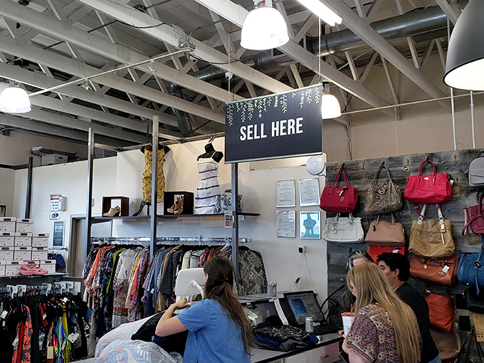 Where fashion gets its second chance. The "Sell Here" counter transforms closet cleanouts into cash or store credit—retail circle of life in action.