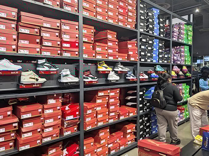 The Nike store's wall of shoes isn't just footwear – it's a temple of athletic aspiration where even couch potatoes momentarily consider running marathons.
