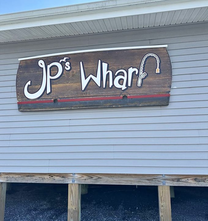 The JP's Wharf sign welcomes you with rustic charm, promising seafood adventures that'll make the drive absolutely worthwhile for anyone. Photo credit: <a href="https://www.yelp.com/user_details?userid=Q9uDr4Gh1x9ustx8bfIawA" target="_blank" rel="noopener noreferrer">Mariellen E.</a> The JP's Wharf sign welcomes you with rustic charm, promising seafood adventures that'll make the drive absolutely worthwhile for anyone.