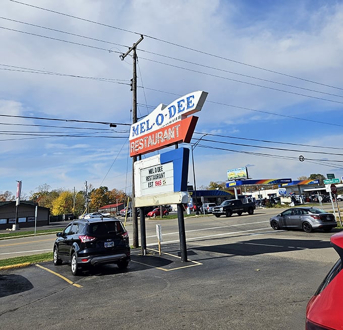 The vintage roadside sign – a North Star for hungry travelers since before GPS told us where to eat.