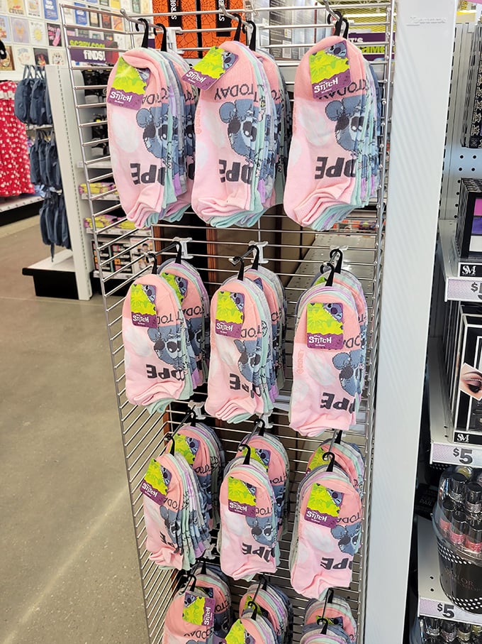 Disney character backpacks lined up like a childhood dream team—Stitch clearly winning the popularity contest among the elementary school set.