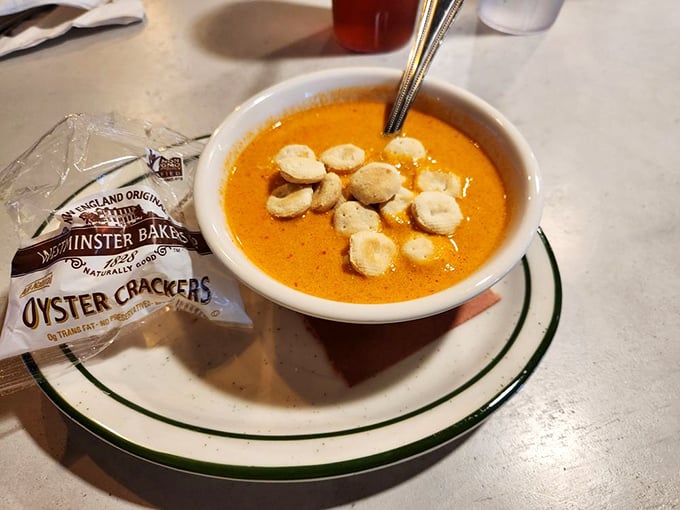 A bowl of seafood soup that warms the soul. Those oyster crackers aren't just garnish—they're the perfect little boats for this flavorful sea.