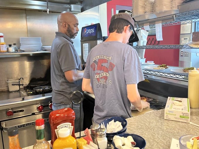 The kitchen crew—breakfast's unsung heroes—orchestrating the morning rush with the precision of NASA engineers but with more bacon.