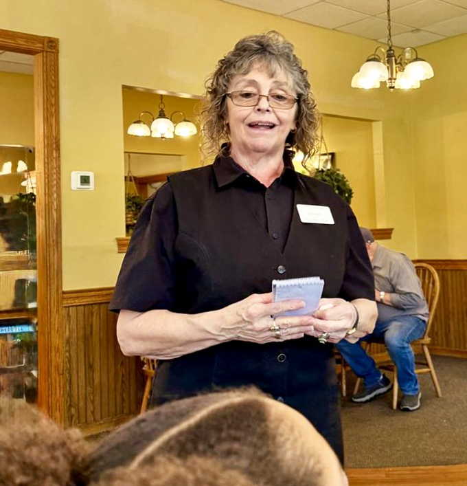 A friendly server with a ready smile—the human embodiment of Midwestern hospitality that makes every diner feel like a regular.
