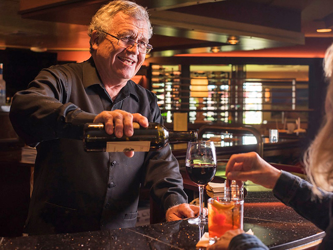Wine service with a smile—where every pour comes with decades of expertise and zero pretension.