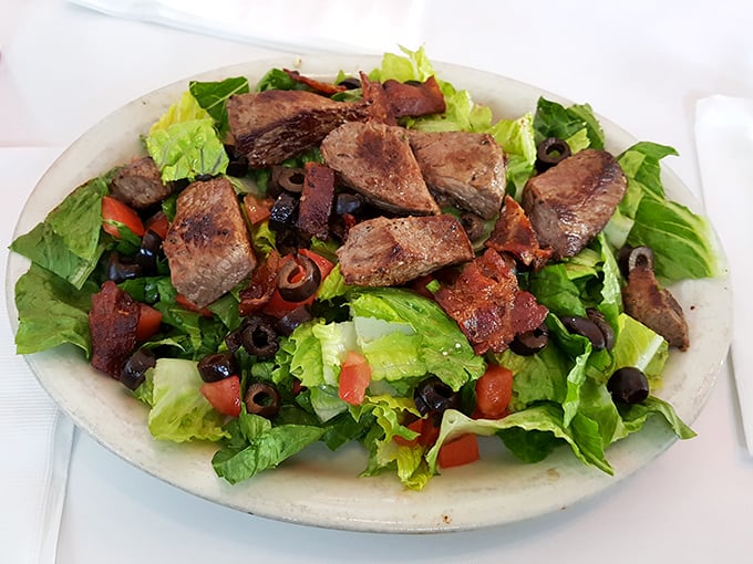 Not all heroes wear capes, but all great salads wear perfectly seared steak. This isn't rabbit food—it's a carnivore's compromise.