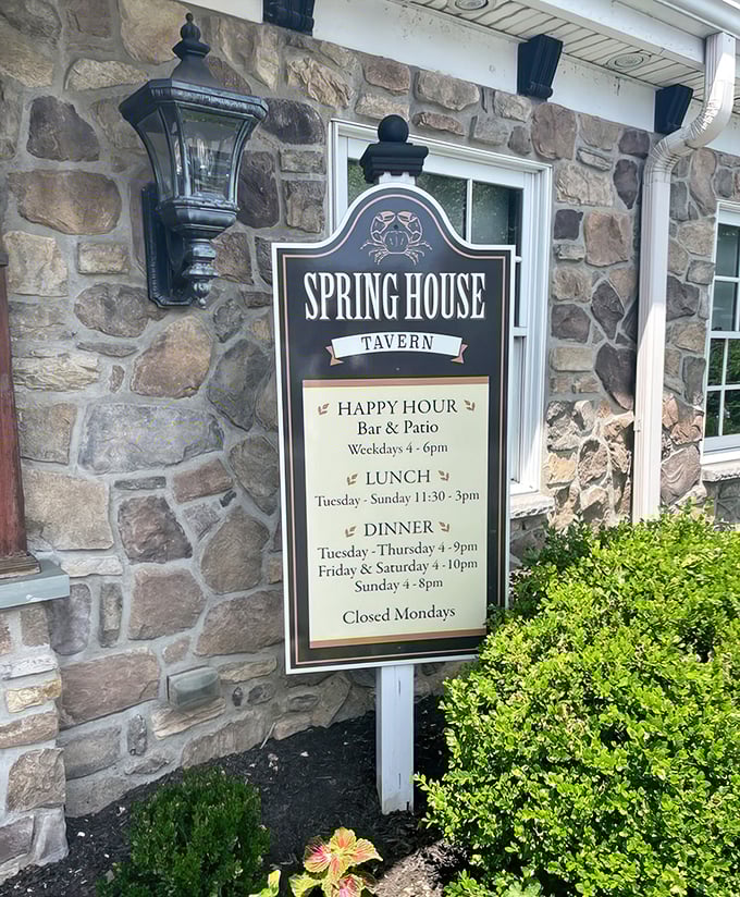 The tavern's sign reveals not just hours but a promise—happy hour, lunch, and dinner schedules that have structured countless local gatherings since 1719.