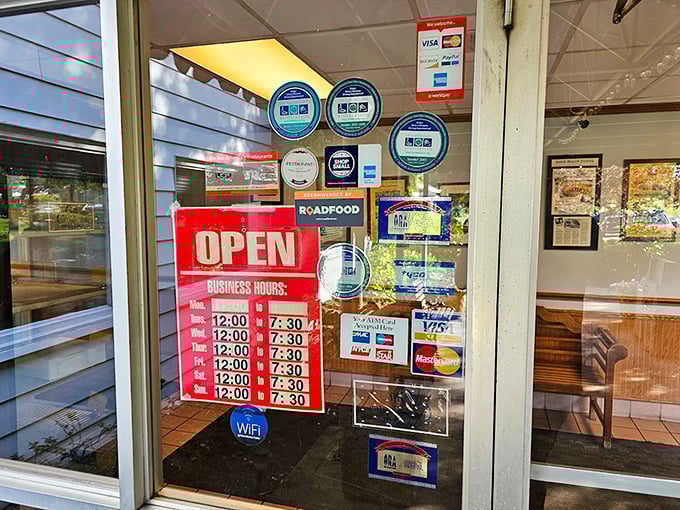 Business hours posted like a promise: "Yes, we'll be here when you need your chicken fix, just like we have been since 1933."