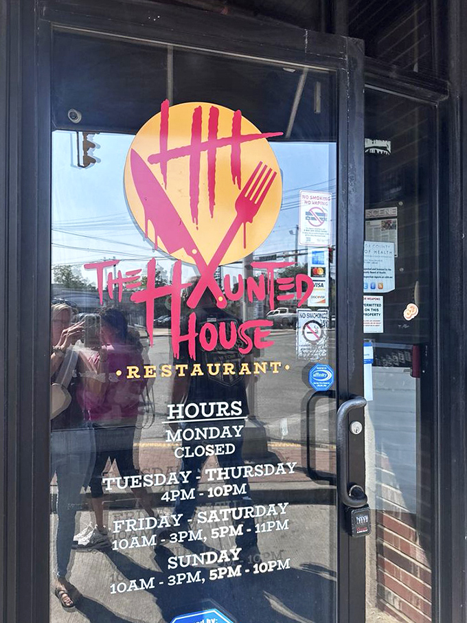 Business hours posted clearly—because even monsters need to know when dinner is served. The glowing logo promises a dining experience worth planning your day around.