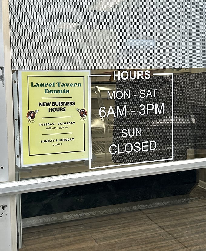 The hours sign delivers both good news and heartbreak—open early for the early birds, but closed Sundays for donut detox.