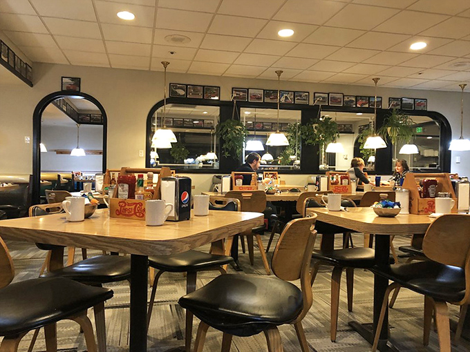 Tables spaced for conversation, pendant lights casting a warm glow – the stage is set for memories made over plates of comfort food.