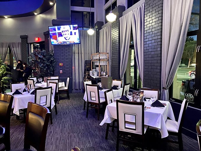 White tablecloths and square-backed chairs create an elegant backdrop for the real stars of the show—the parade of meats heading your way.