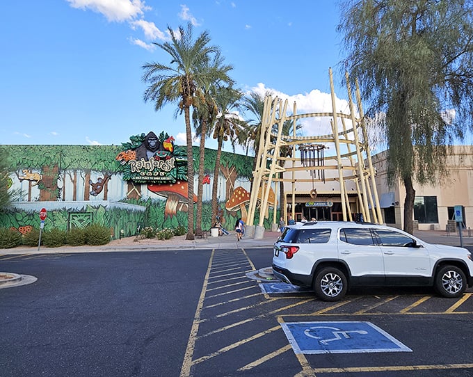 The Rainforest Cafe's exterior hints at the jungle adventure within—a place where "indoor thunderstorms" are the only weather events Arizonans actually look forward to.