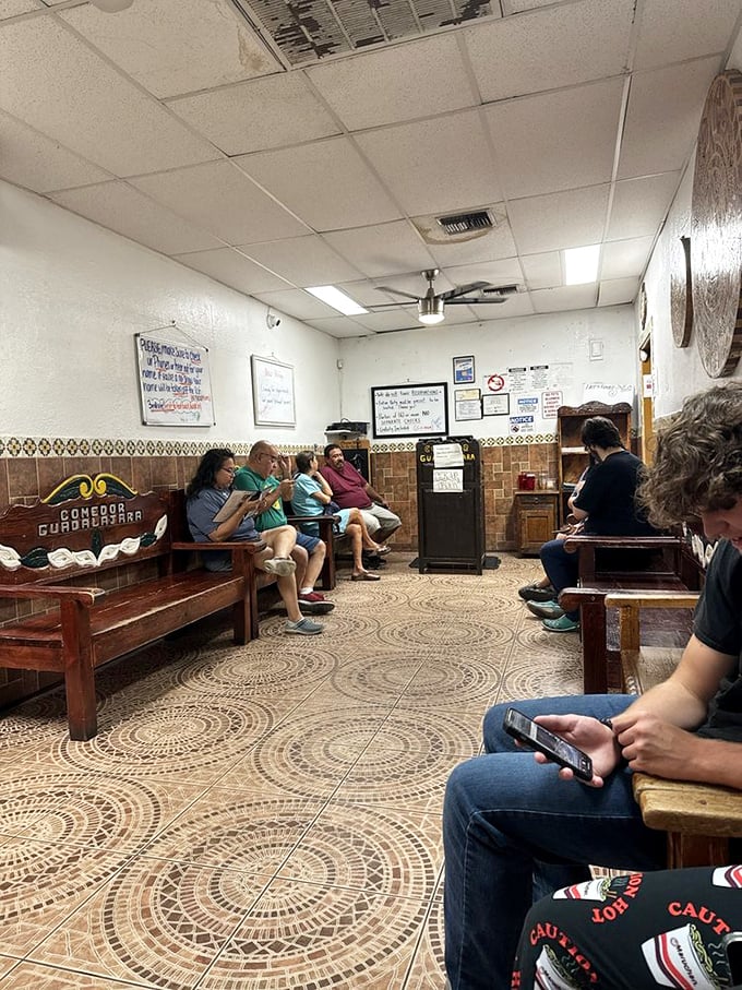 The waiting area—where anticipation builds and strangers become temporary friends united by a common mission: authentic Mexican cuisine.