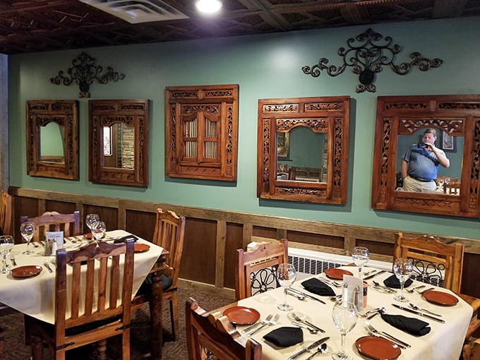 Wooden tables with intricate iron details—where countless anniversary dinners and business deals have been celebrated.