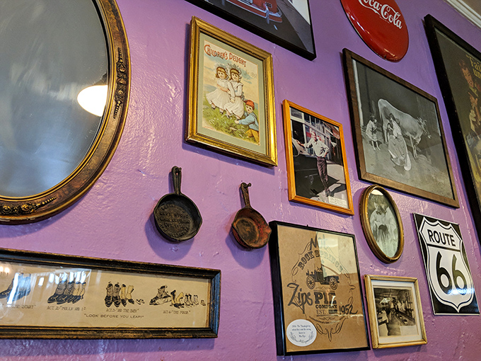 Purple walls showcase the restaurant's soul—cast iron pans and vintage photos tell stories that make the food taste even better.