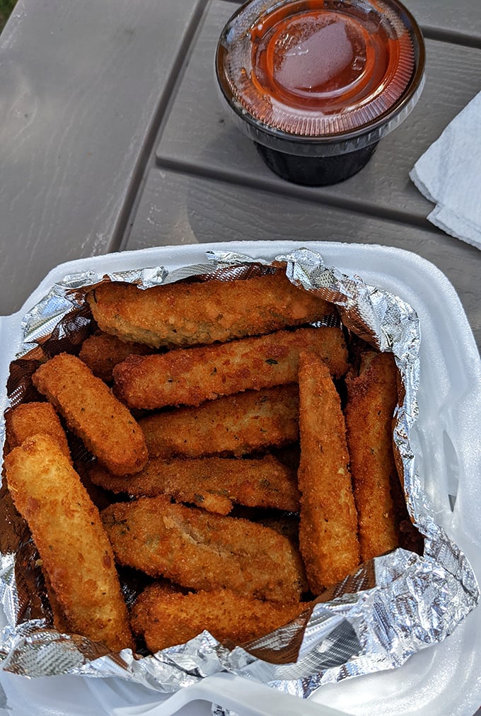 These aren't just any zucchini sticks—they're golden-armored vegetable soldiers ready to dive into marinara's welcoming embrace.