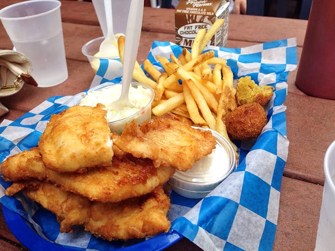 Layer upon layer of flaky whitefish fillets stacked like treasure, flanked by golden fries and creamy coleslaw—a Michigan feast fit for royalty.
